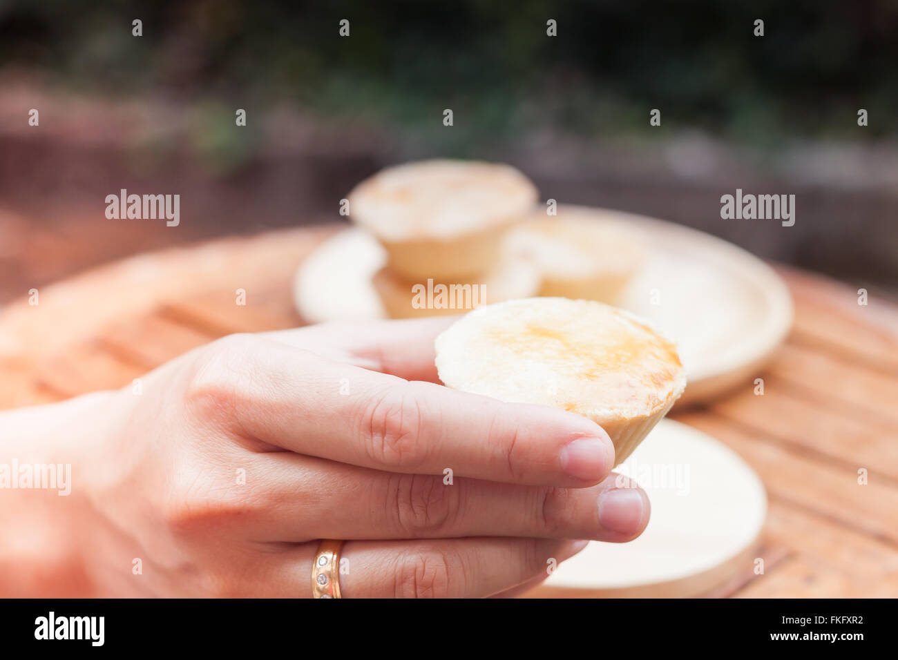 Hand holding pie hi-res stock photography and images - Alamy