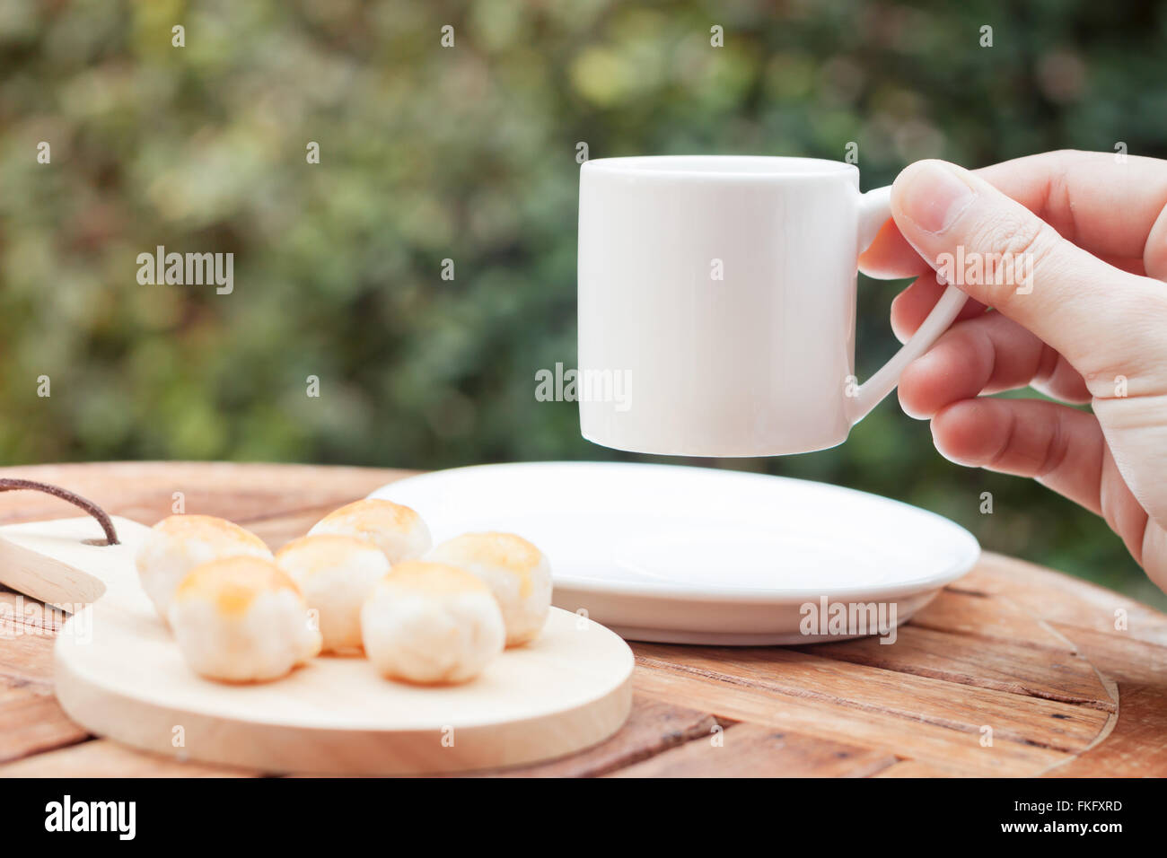 Woman's hand holding coffee cup, stock photo Stock Photo - Alamy