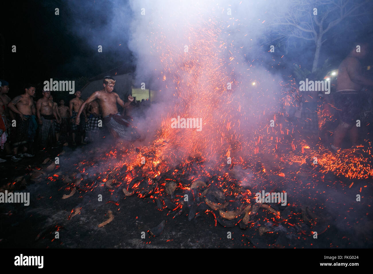 Gianyar, Indonesia. 08th Mar, 2016. Balinese man kicks up and throw the ...