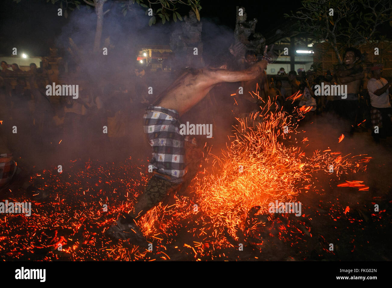Gianyar, Indonesia. 08th Mar, 2016. Balinese man kicks up and throw the ...