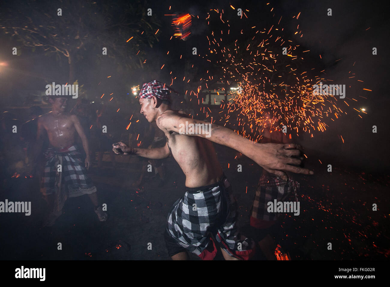 Gianyar, Indonesia. 08th Mar, 2016. Balinese man kicks up and throw the ...