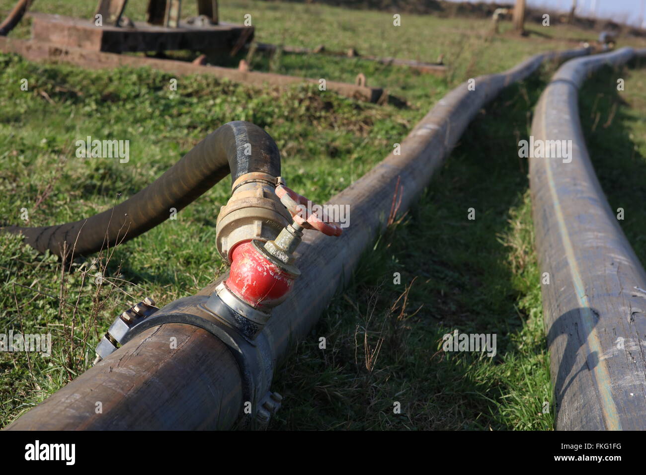 Two water pipelines with red branch Stock Photo - Alamy