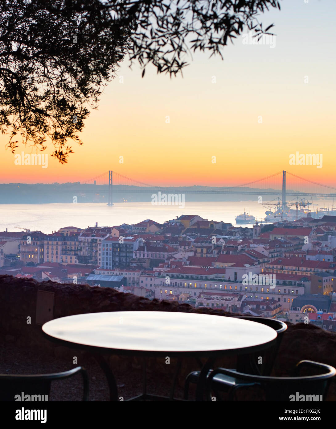 Outdoor restaurant with overview of Lisbon at sunset. Portugal Stock ...