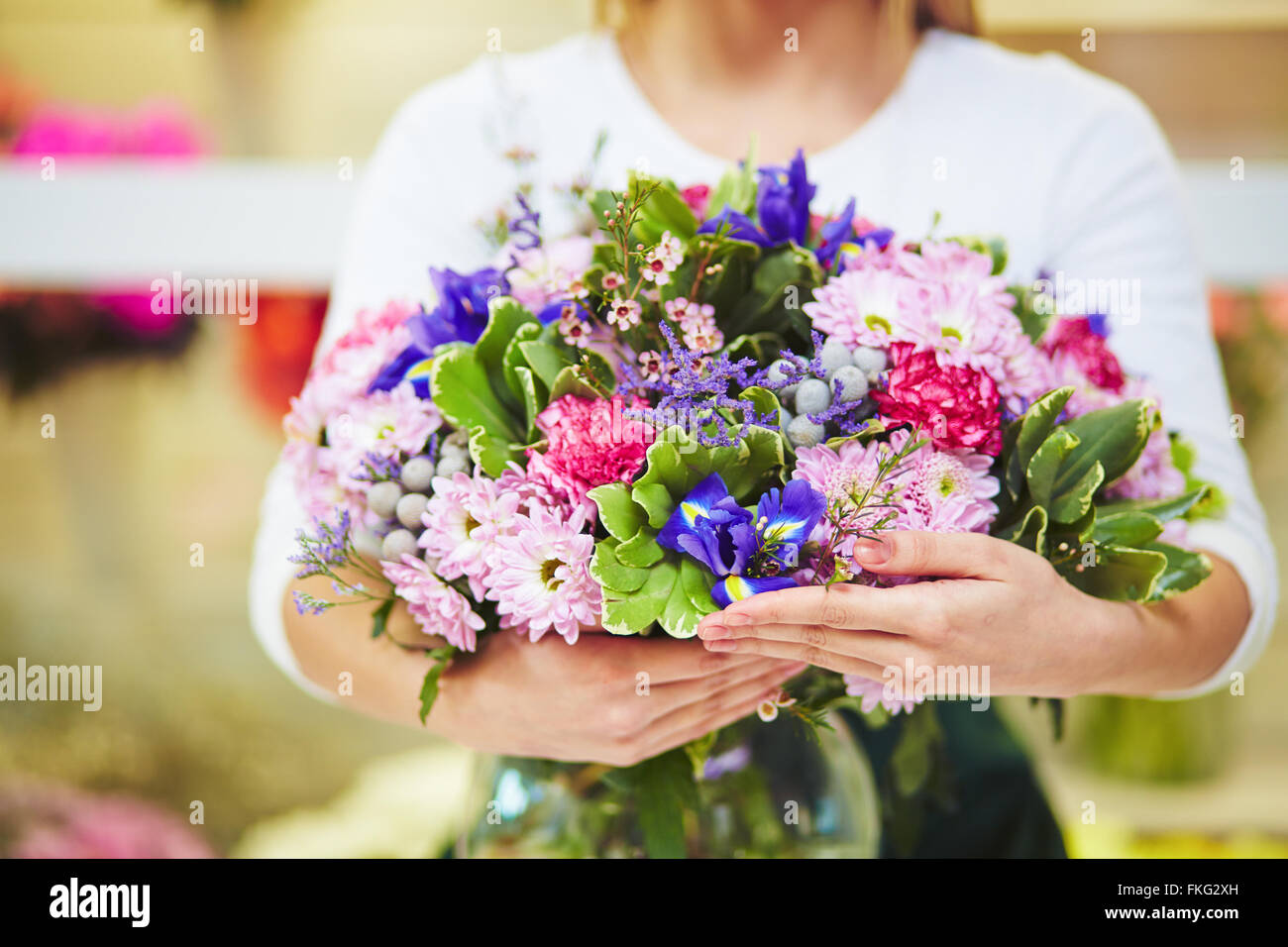 Close-up of female hands holding bouquet of flowers Stock Photo - Alamy