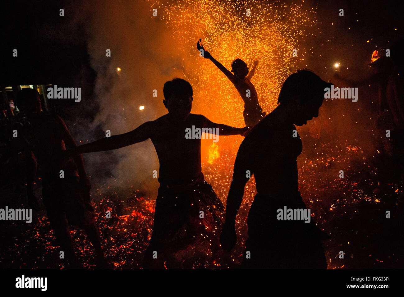 Bali, Indonesia. 08th Mar, 2016. A Balinese man swings burned coconut ...