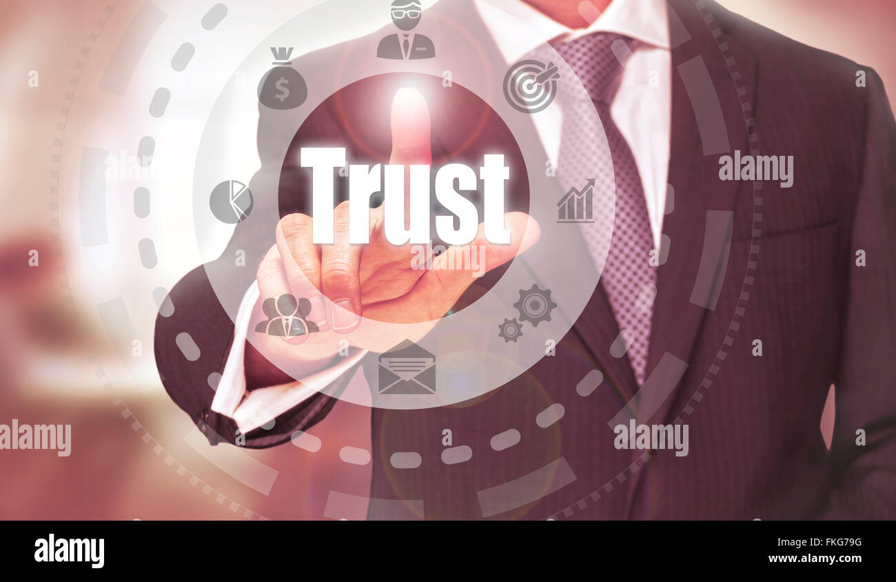 Businessman pressing an Trust concept button Stock Photo - Alamy