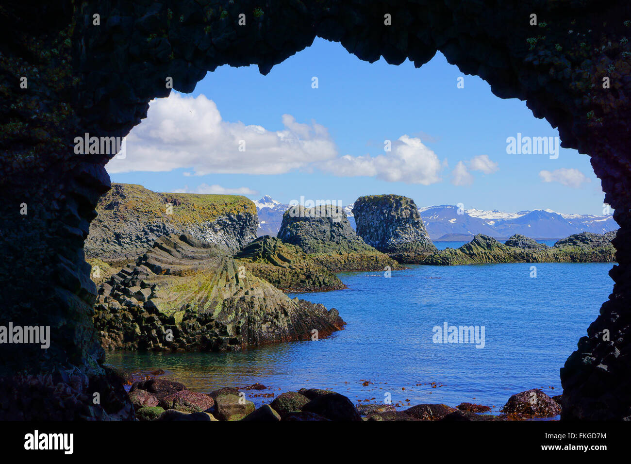 Shoreline and cliffs of basalt rock at Arnarstapi nature reserve seen ...