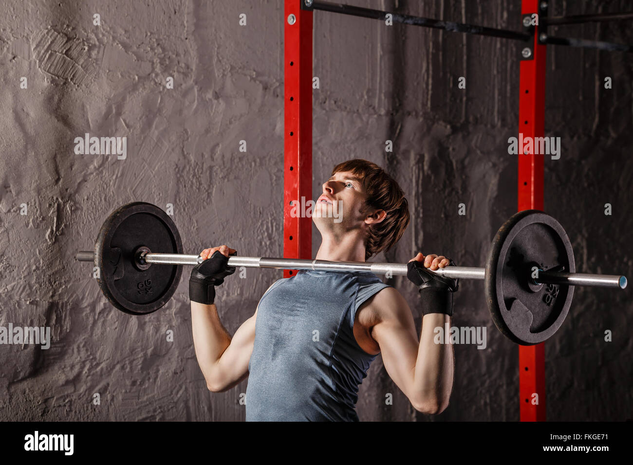 Man pushes the bar. Healthy lifestyle concept. Fitness club Stock Photo ...