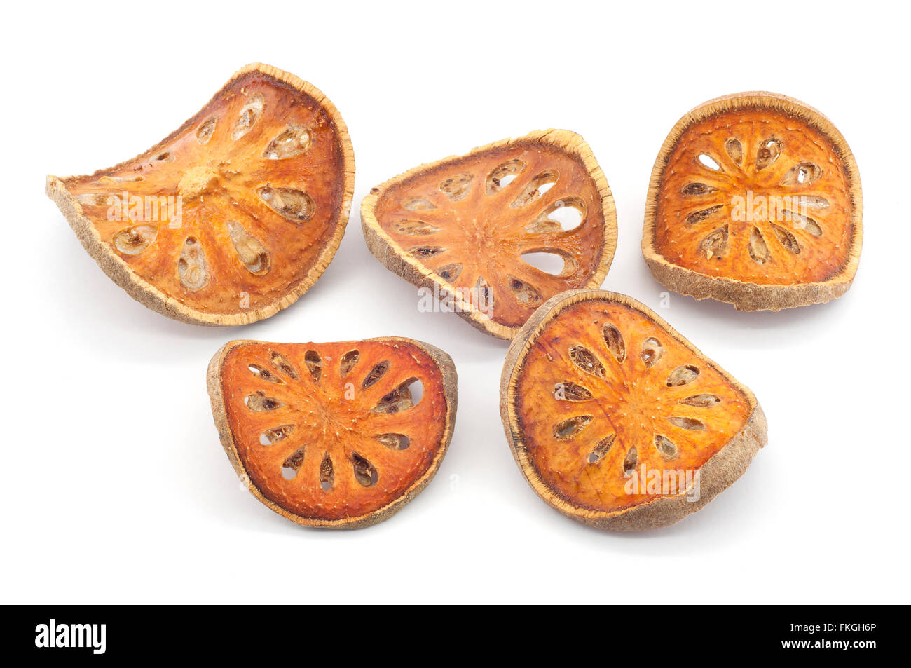 Dried Bael fruit, Thai style food preservation isolated on white ...