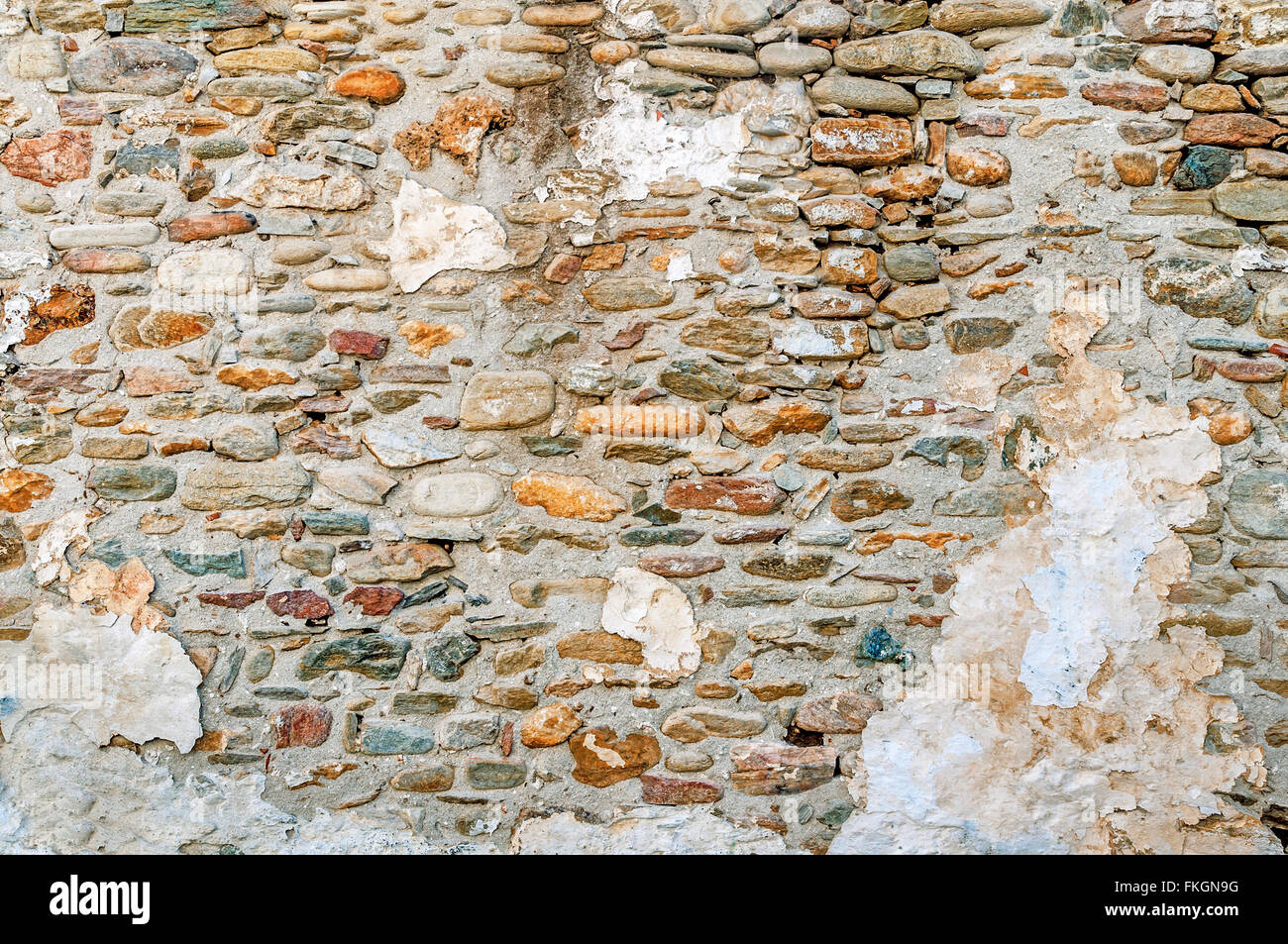Wall texture made of pebbles stone Stock Photo - Alamy