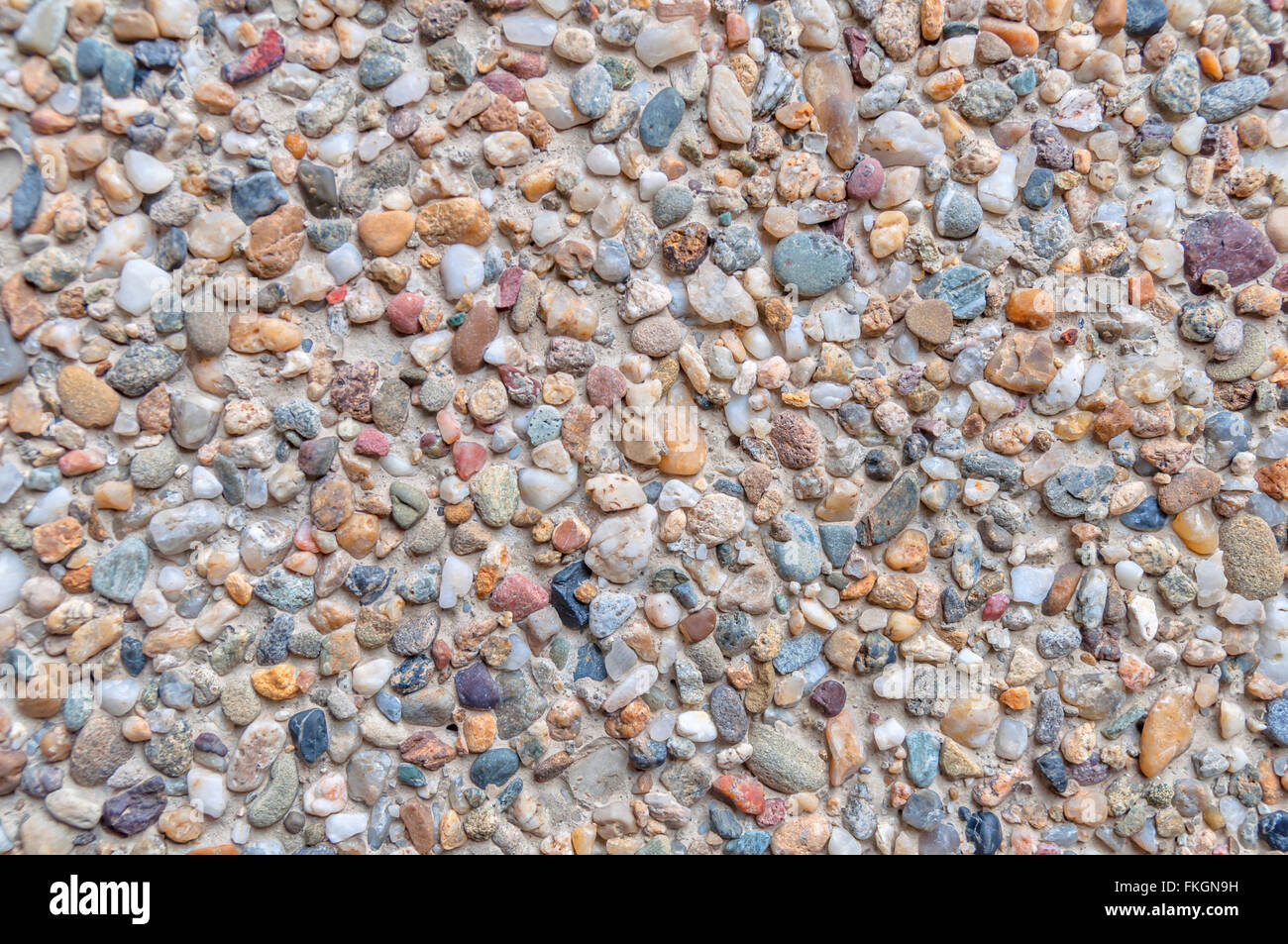 Wall texture made of pebbles stone Stock Photo - Alamy