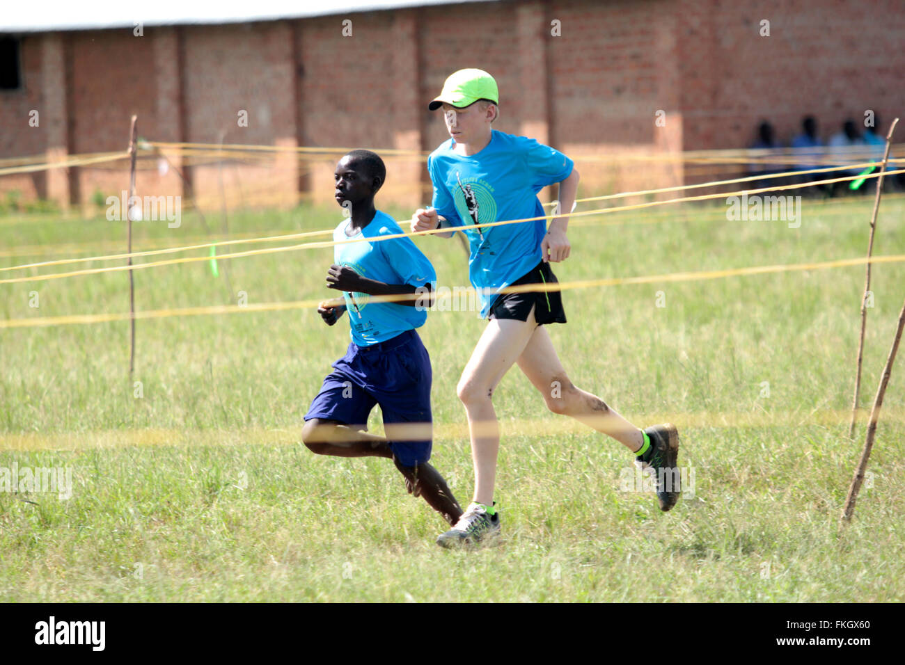 Young athletes compete in a community run in rural Uganda Stock Photo ...