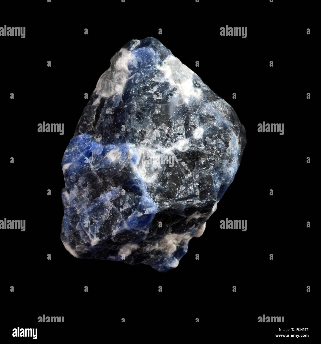raw sodalite stone, isolated on black background Stock Photo - Alamy