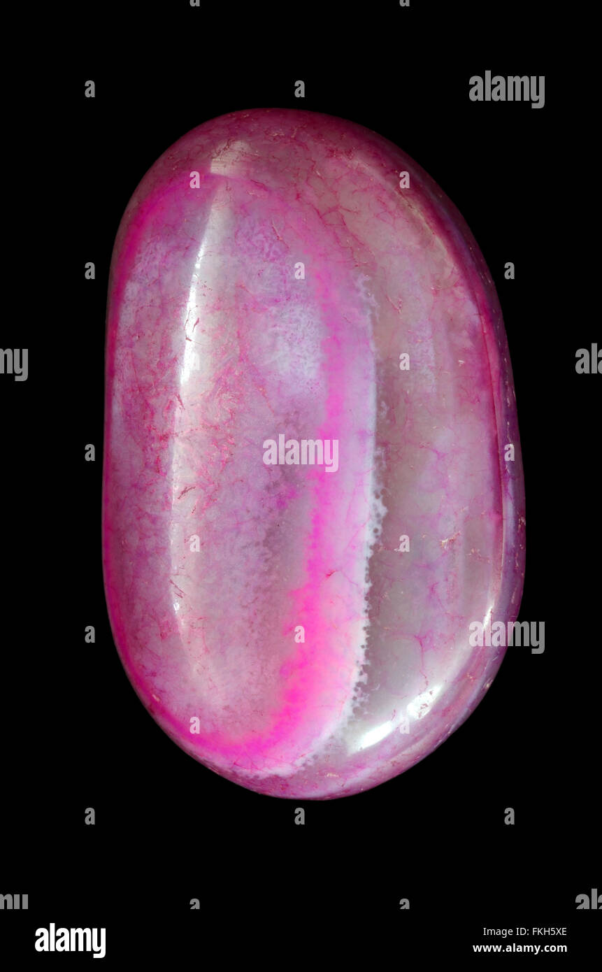 Pink Agate stone, isolated on black background Stock Photo - Alamy