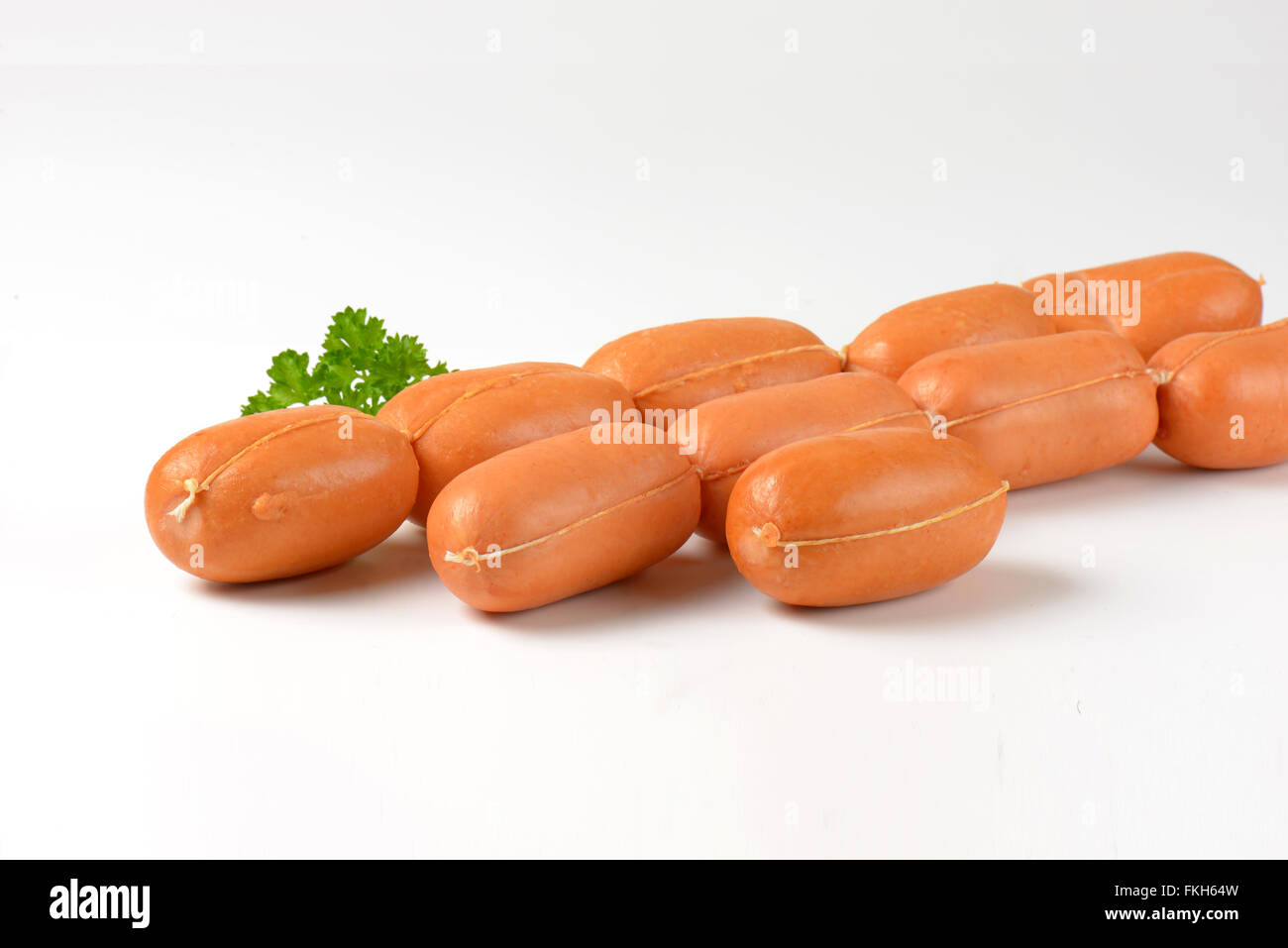 chains of raw sausages on white background Stock Photo - Alamy