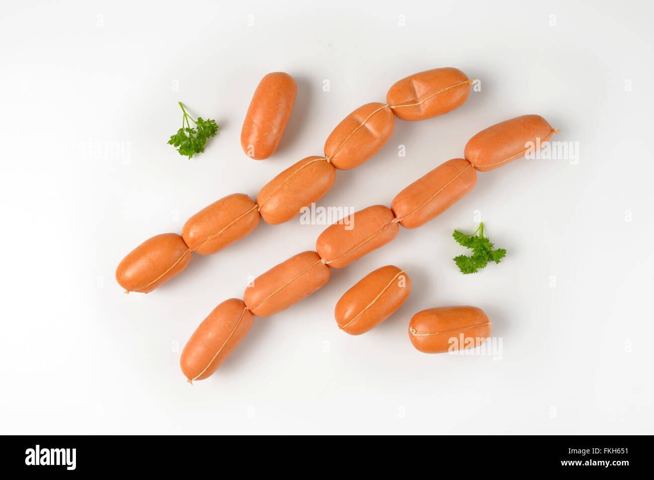 chains of raw sausages on white background Stock Photo - Alamy