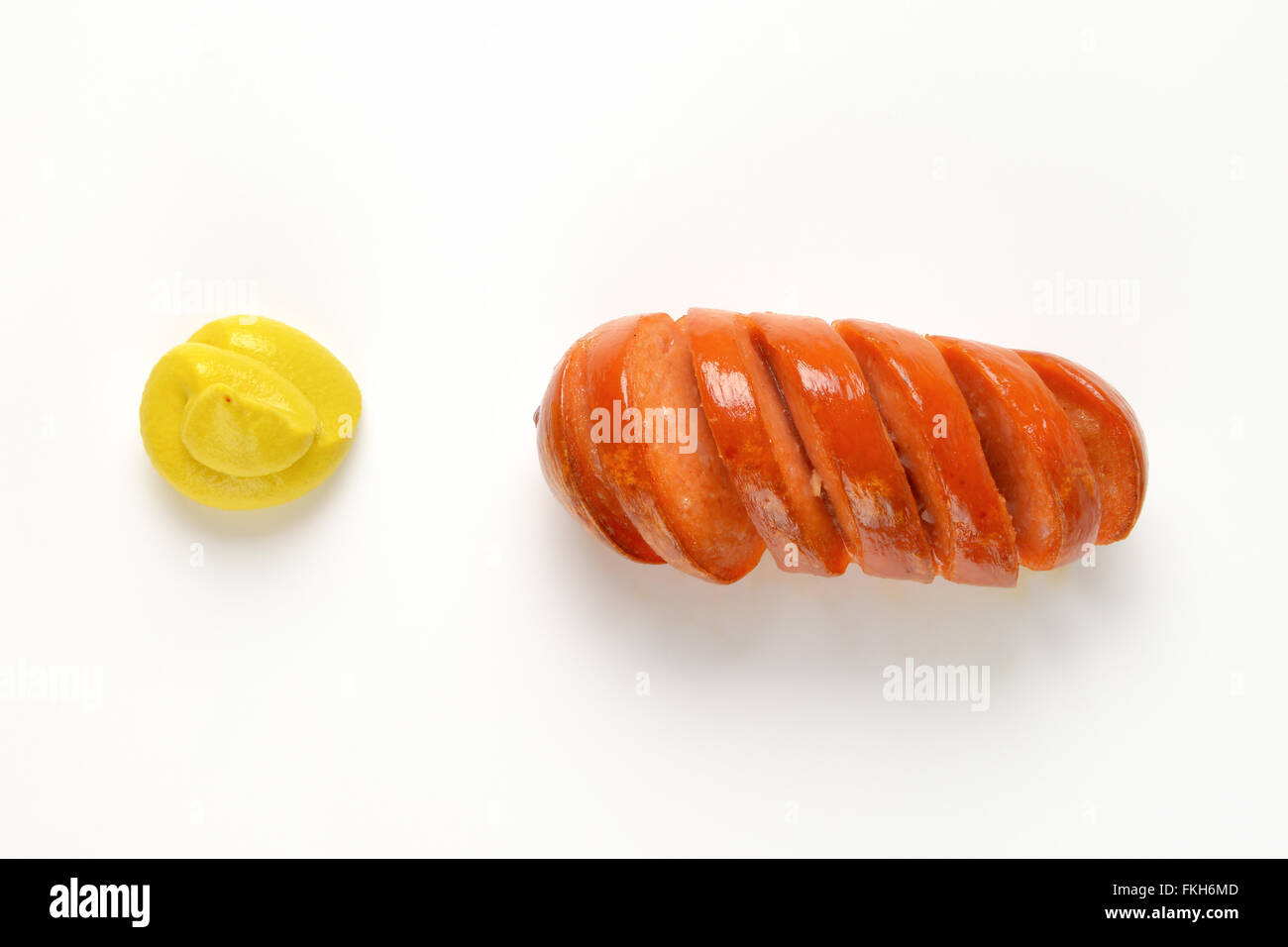 roasted sausage and mustard swirl on white background Stock Photo - Alamy
