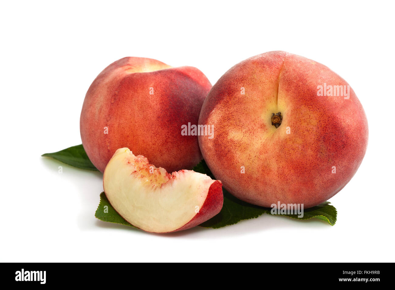 Two peaches isolated on white Stock Photo - Alamy