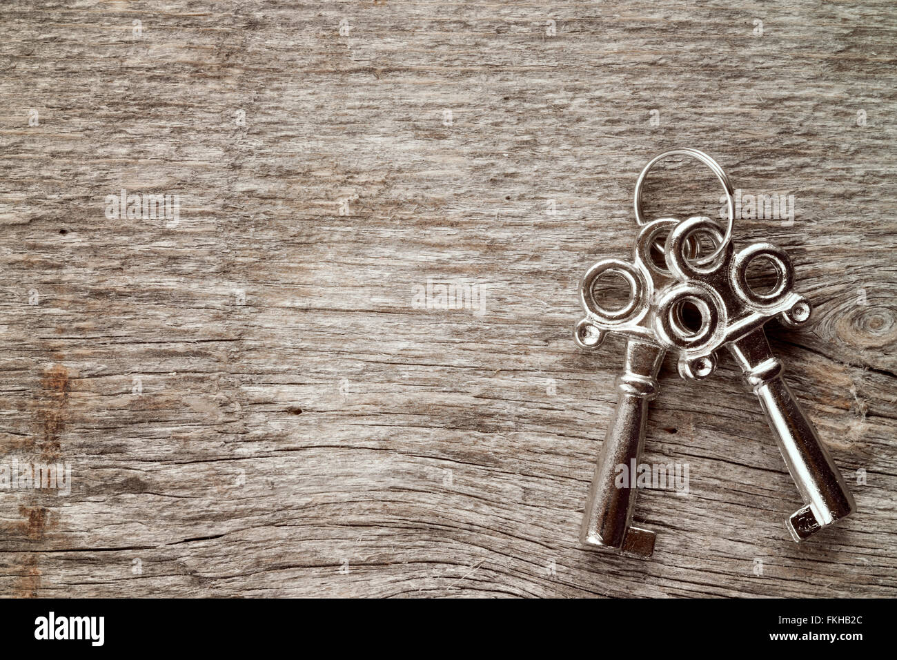 Pair of two small keys on wooden background with copy-space Stock Photo ...
