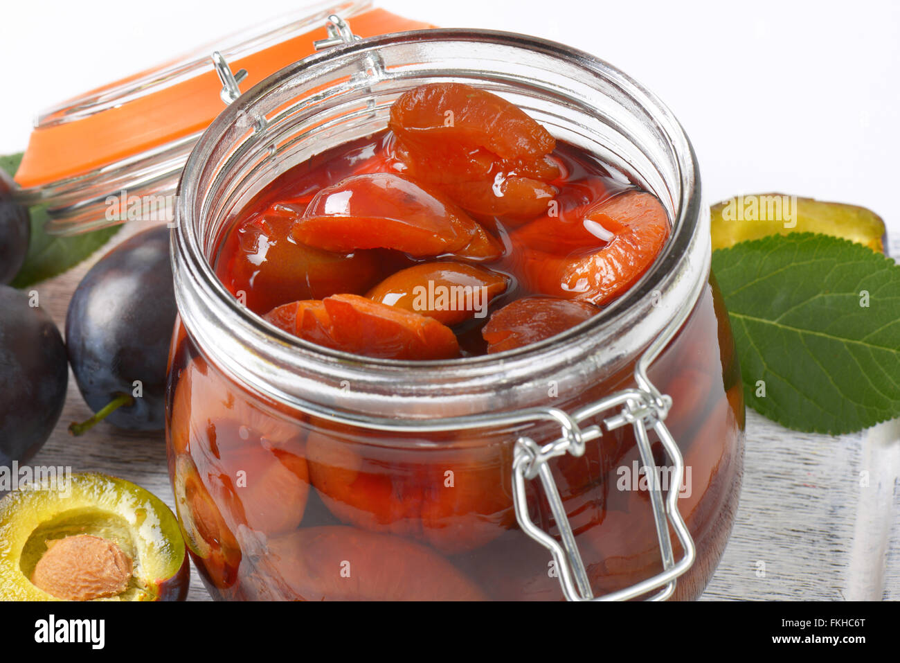 close up of preserved plums in opened jar Stock Photo - Alamy