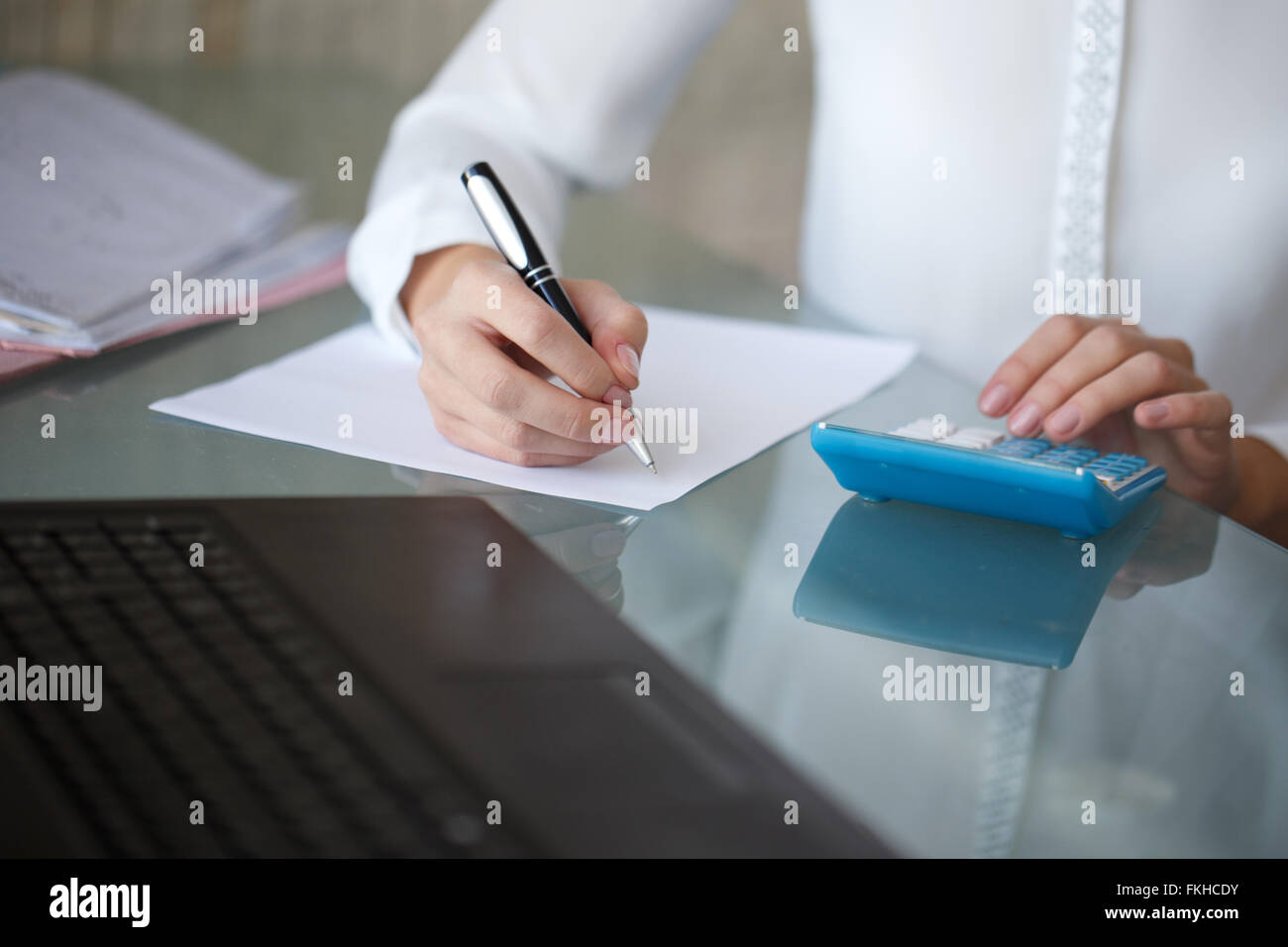 Accountant write on blank paper in office, closeup Stock Photo - Alamy