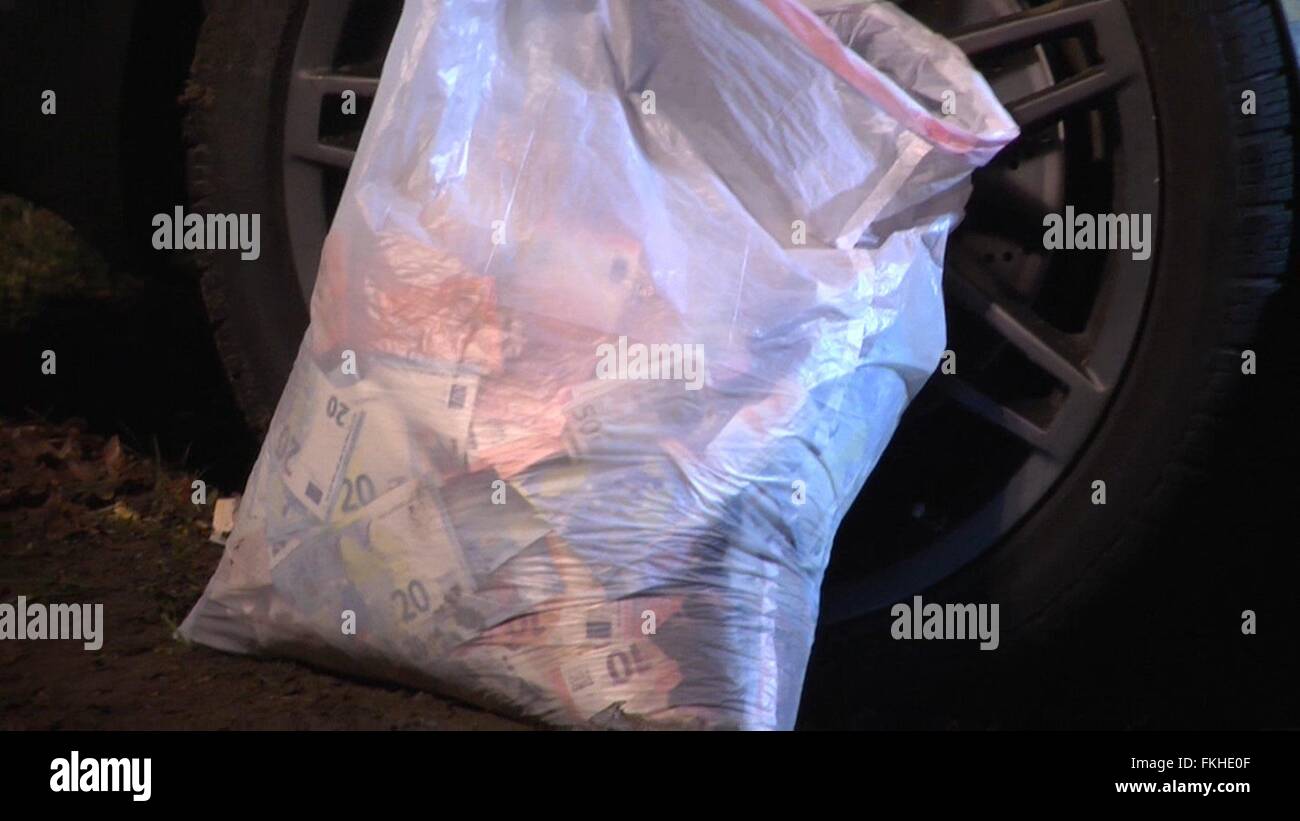 Meppen, Germany. 09th Mar, 2016. A bag of cash from an ATM robbery sits ...