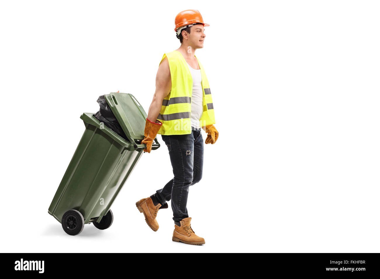 Full length portrait of a male waste collector dragging a trash can ...