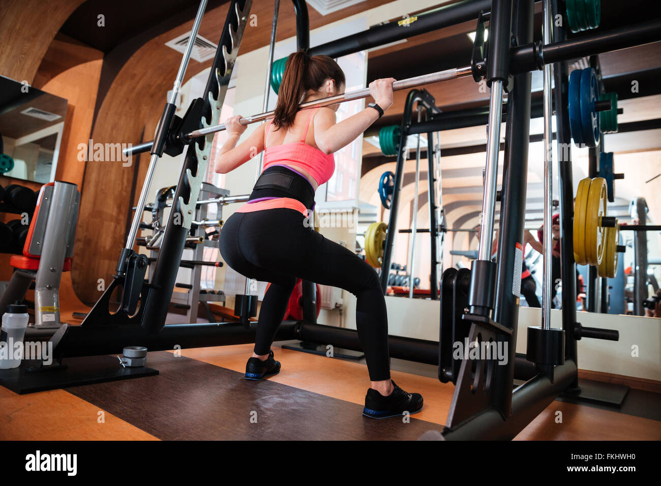 Woman squats in gym hi-res stock photography and images - Alamy