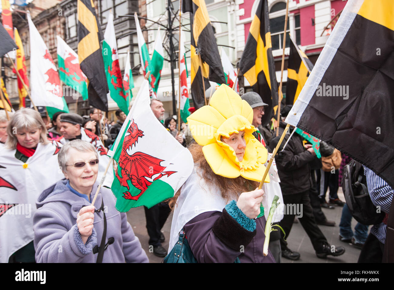 Wearing,Daffodil,hat,and,waving,red dragon,national,flag,at,St David's ...