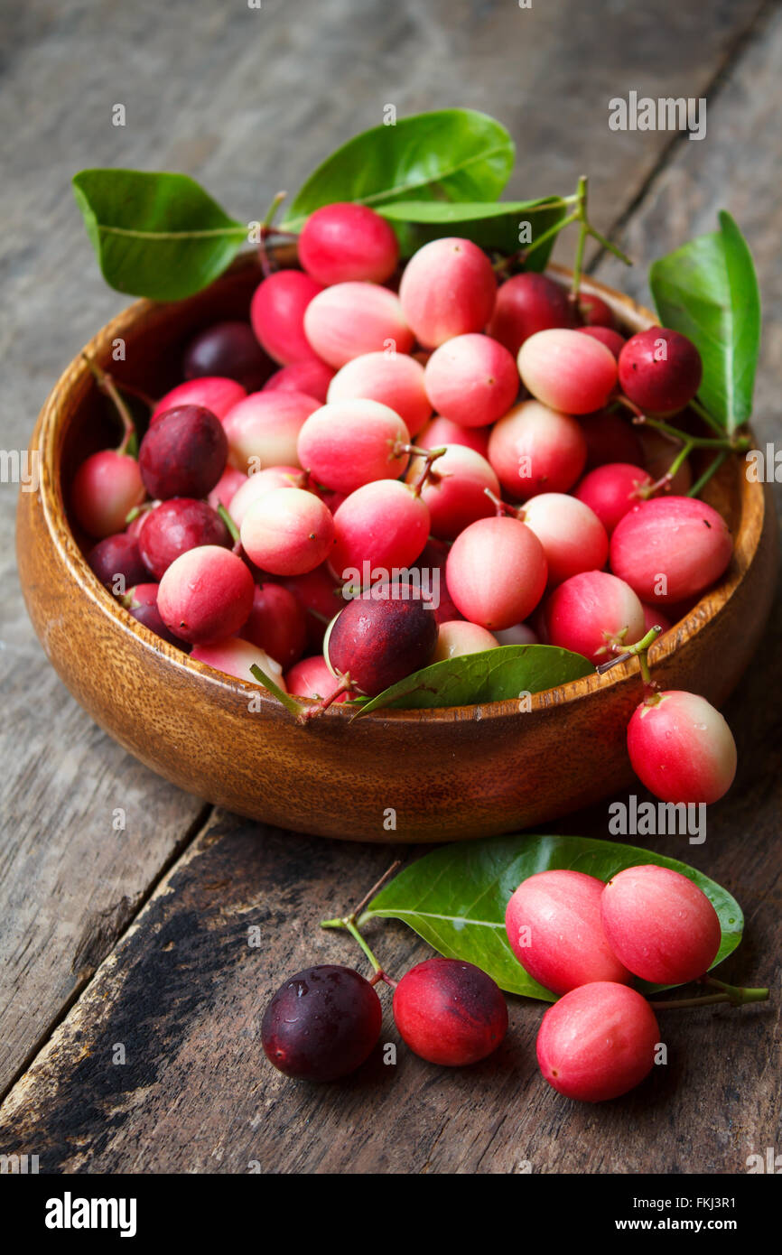karanda fruit, carissa carandas on the old wood background Stock Photo ...
