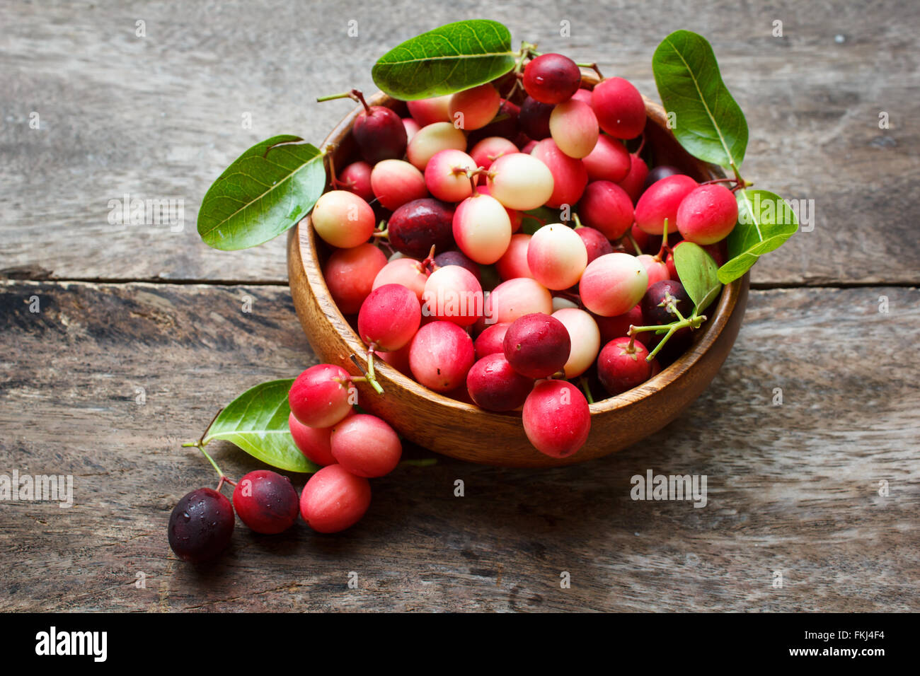 karanda fruit, carissa carandas on the old wood background Stock Photo ...