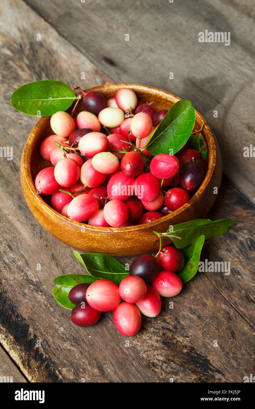 karanda fruit, carissa carandas on the old wood background Stock Photo ...