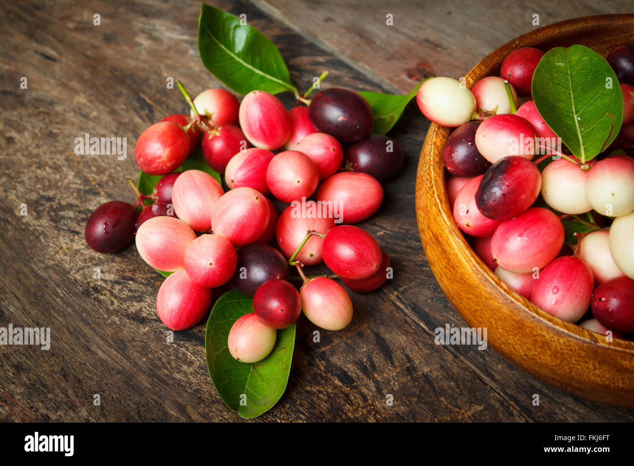 karanda fruit, carissa carandas on the old wood background Stock Photo ...