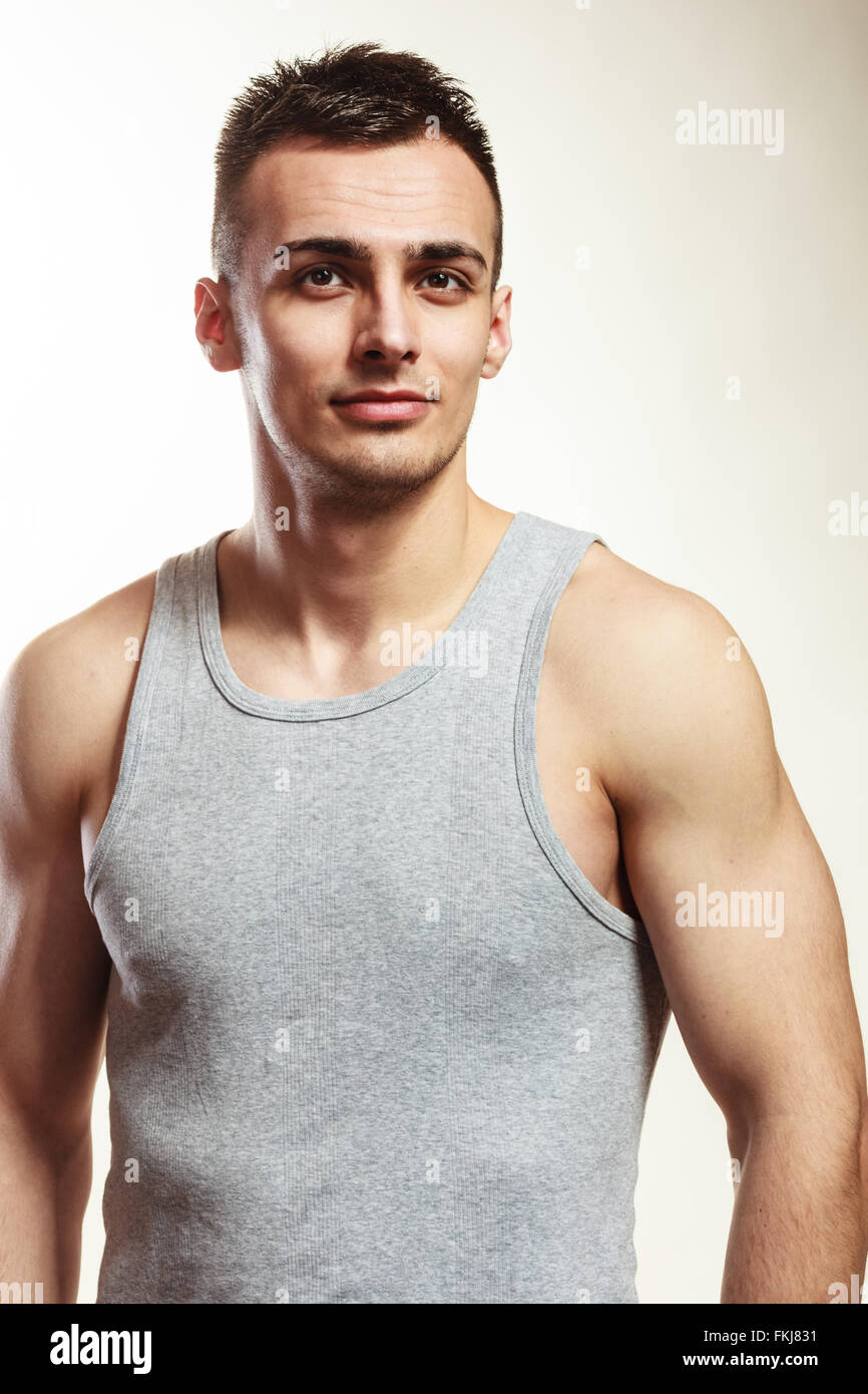 Handsome muscled sporty fit man. Portrait of young muscular guy in ...