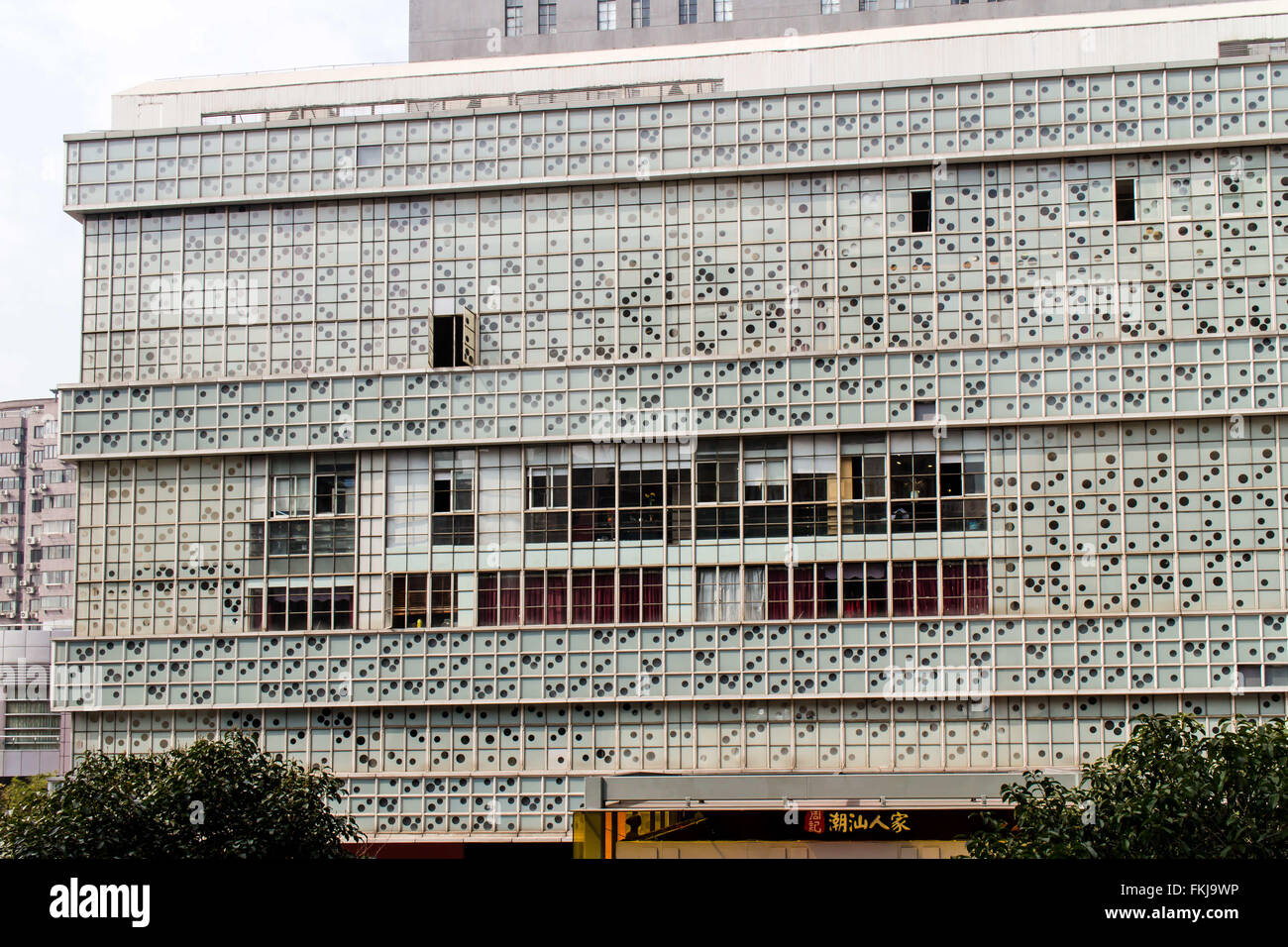 Shanghai, Shanghai, CHN. 7th Mar, 2016. A building covered with bullet ...