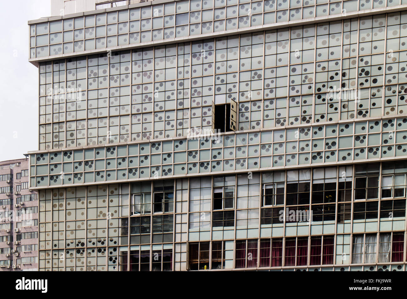 Shanghai, Shanghai, CHN. 7th Mar, 2016. A building covered with bullet ...