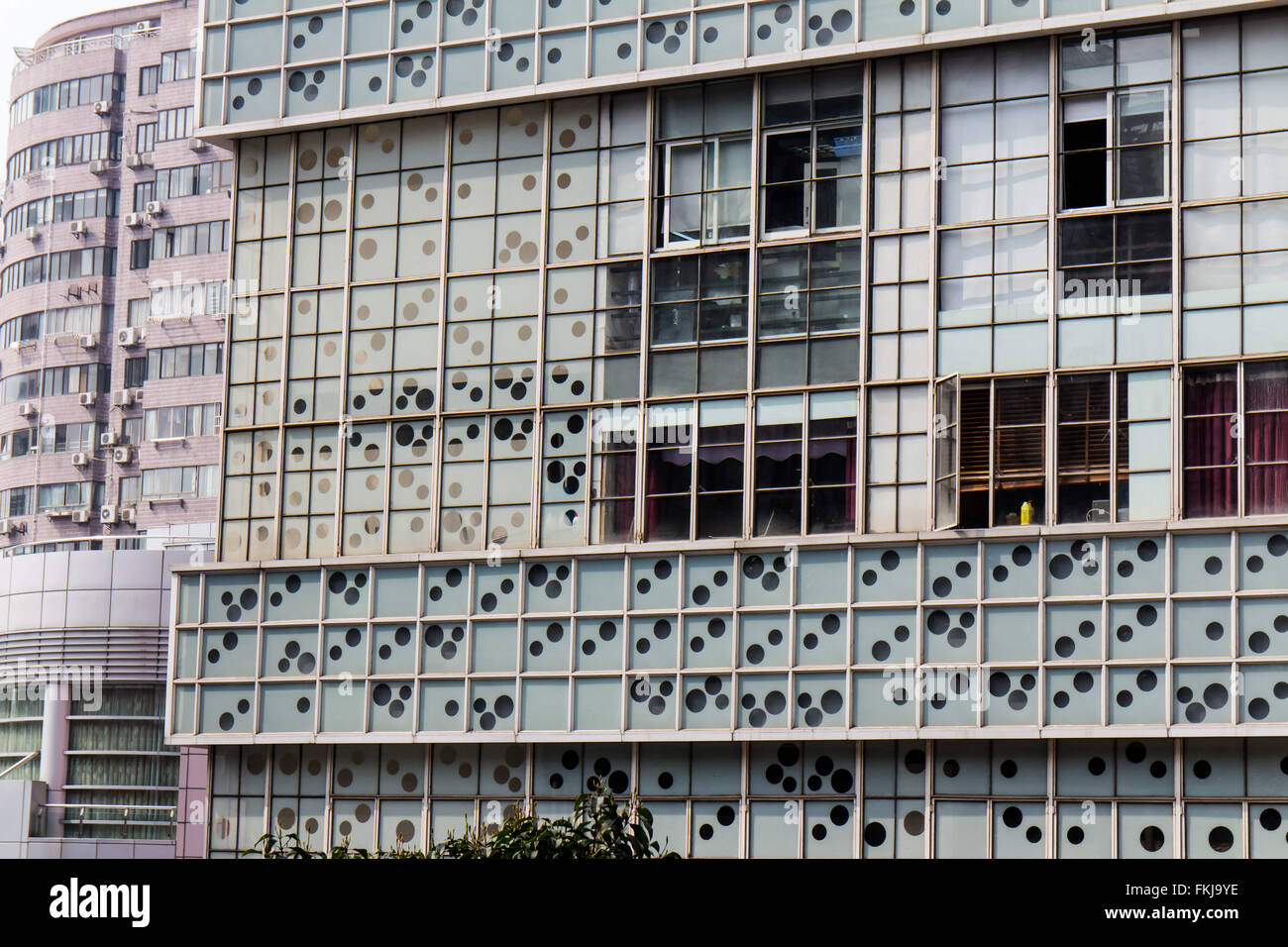 Shanghai, Shanghai, CHN. 7th Mar, 2016. A building covered with bullet ...