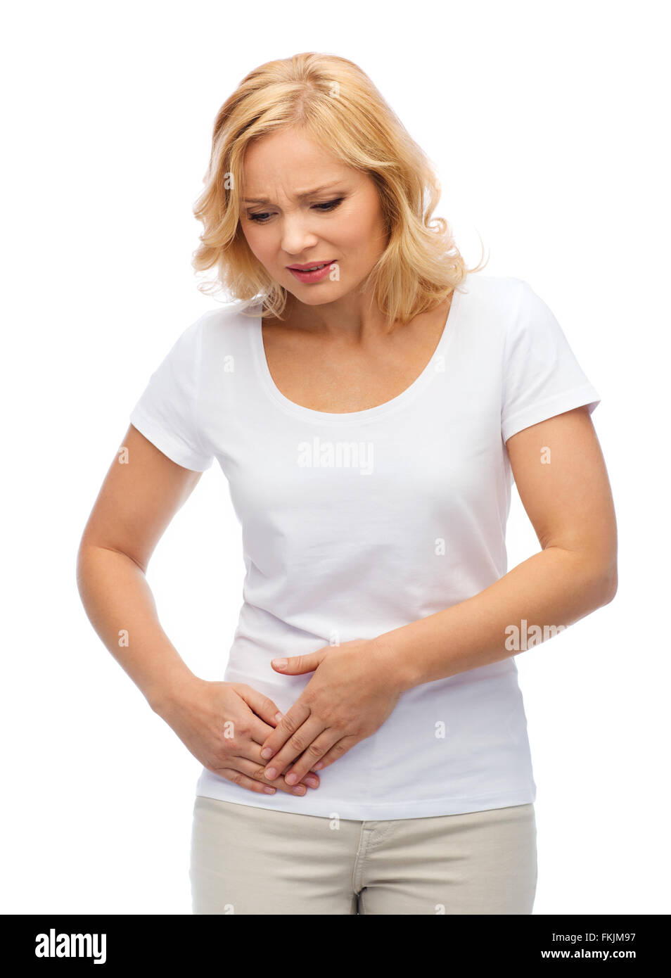 unhappy woman suffering from stomach ache Stock Photo - Alamy