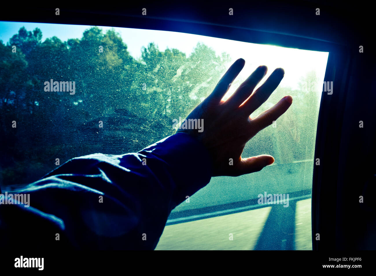 A hand on a glass of a window Stock Photo - Alamy