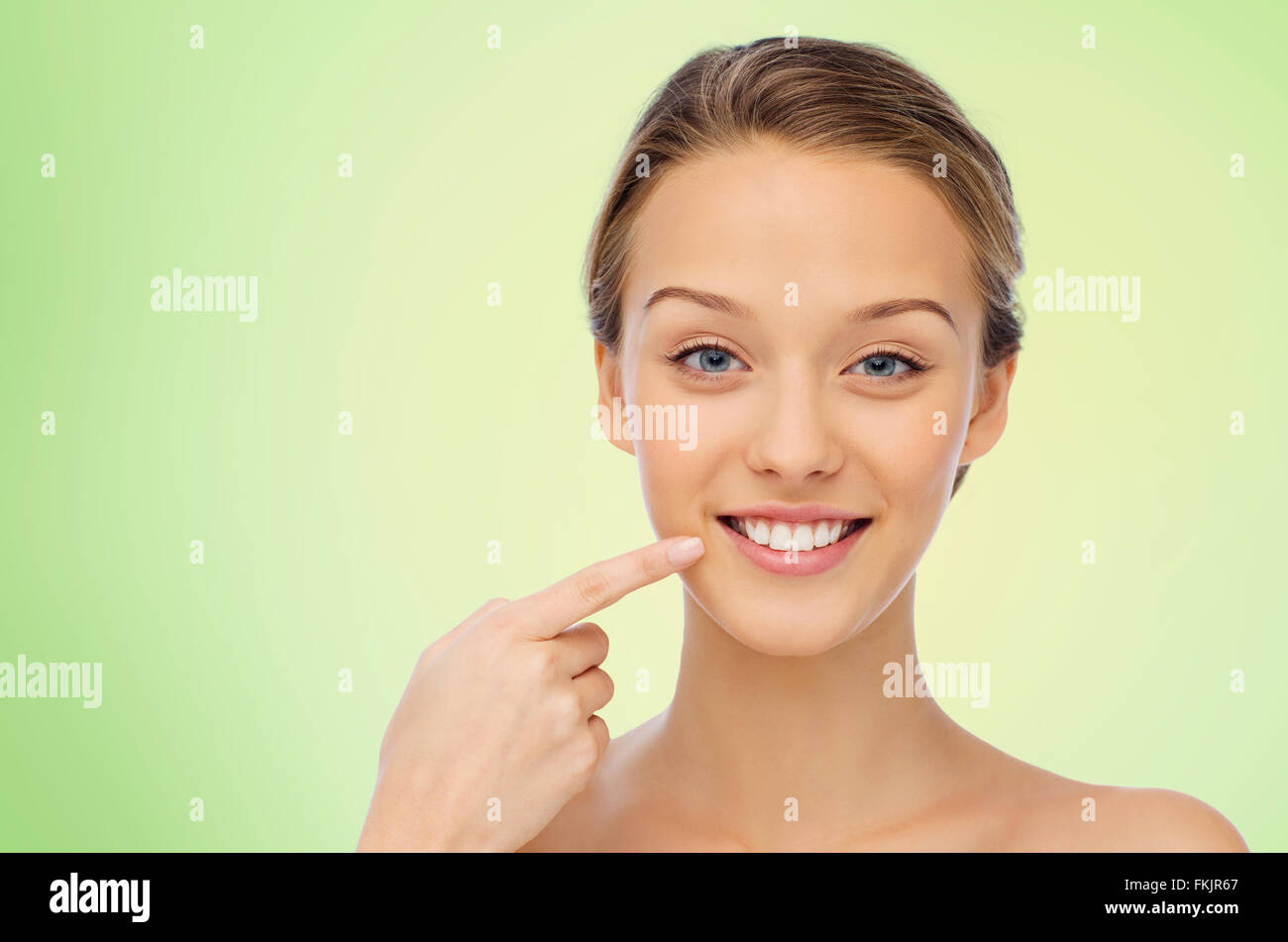 Finger at teeth hi-res stock photography and images - Alamy