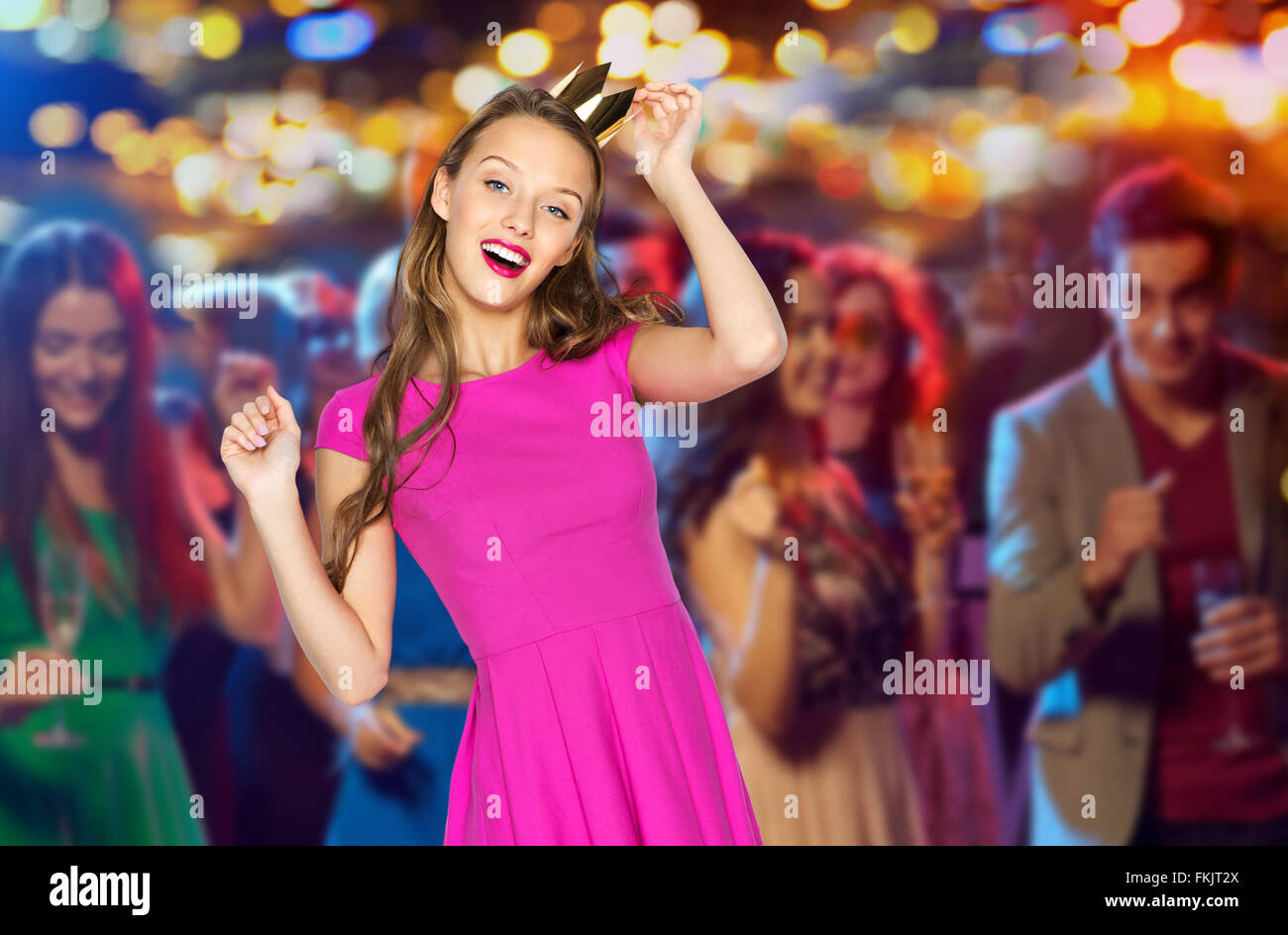 happy young woman in princess crown at night club Stock Photo - Alamy