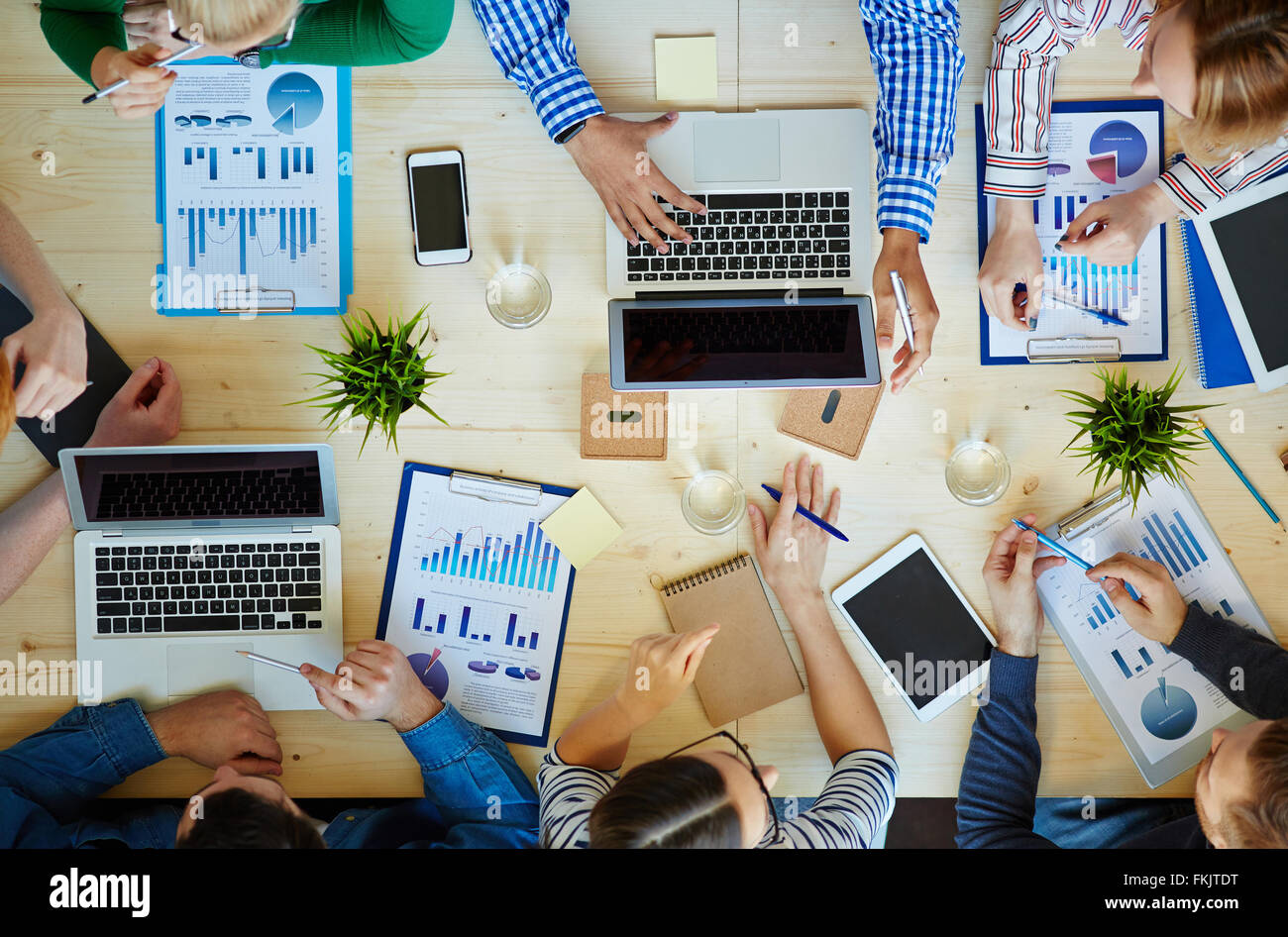 Above view of business people working with computers at the table Stock ...