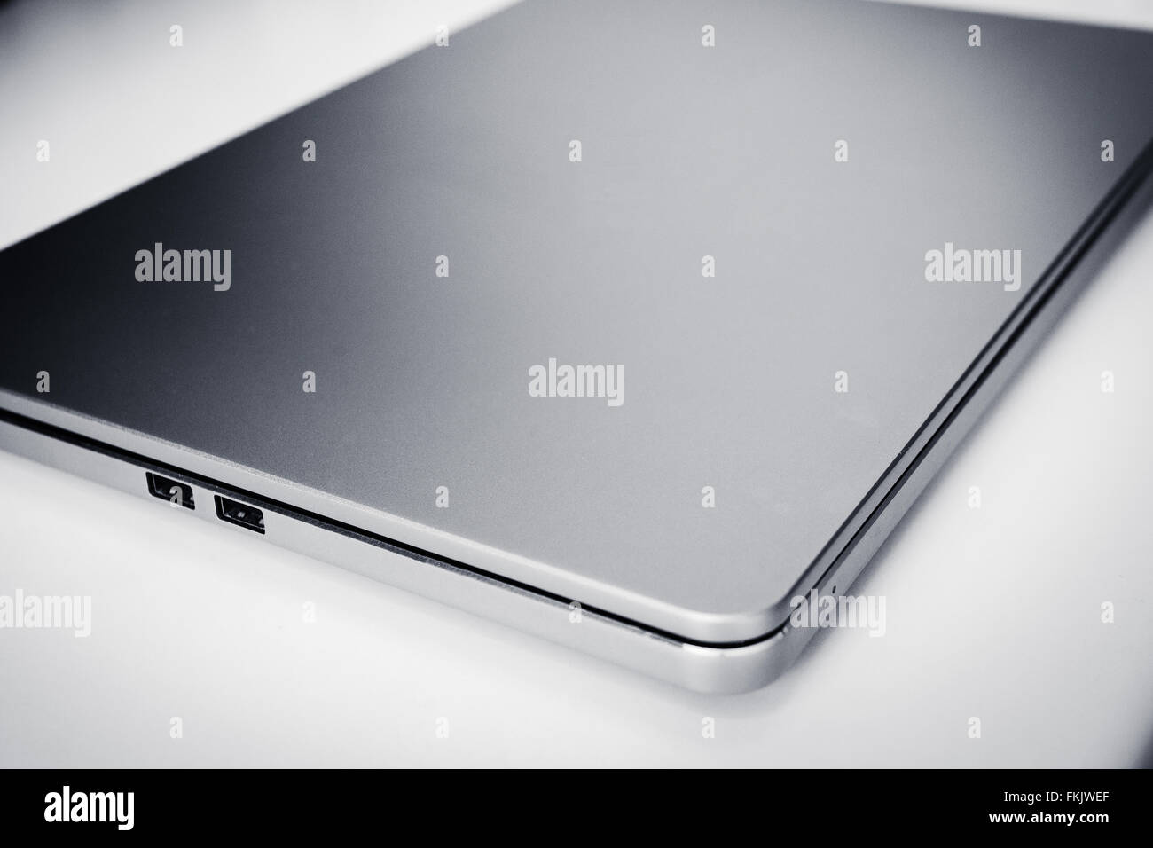 Stylish modern metallic laptop on a white background Stock Photo - Alamy
