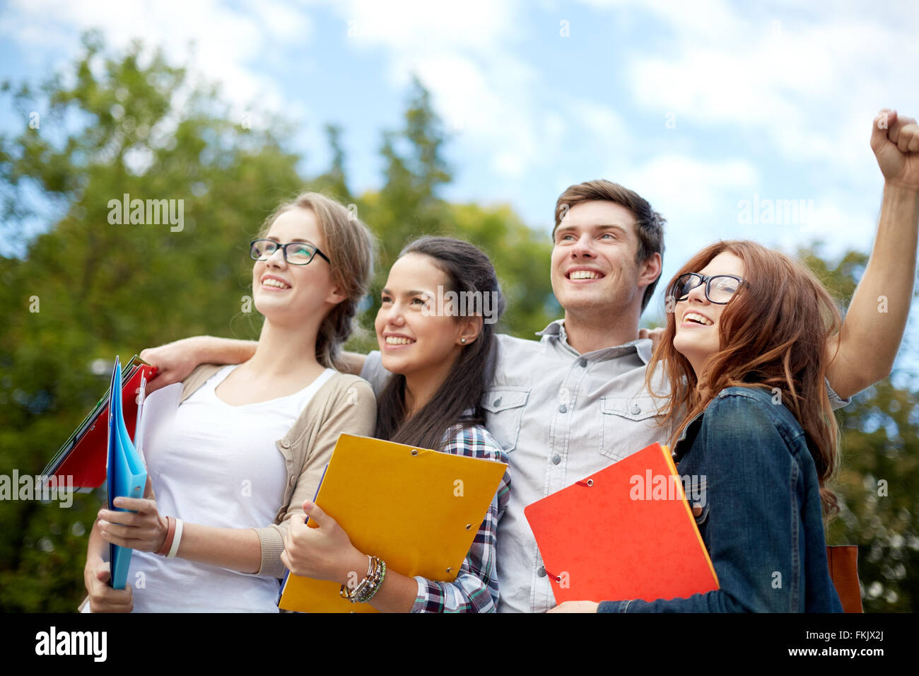 group of happy students showing triumph gesture Stock Photo - Alamy