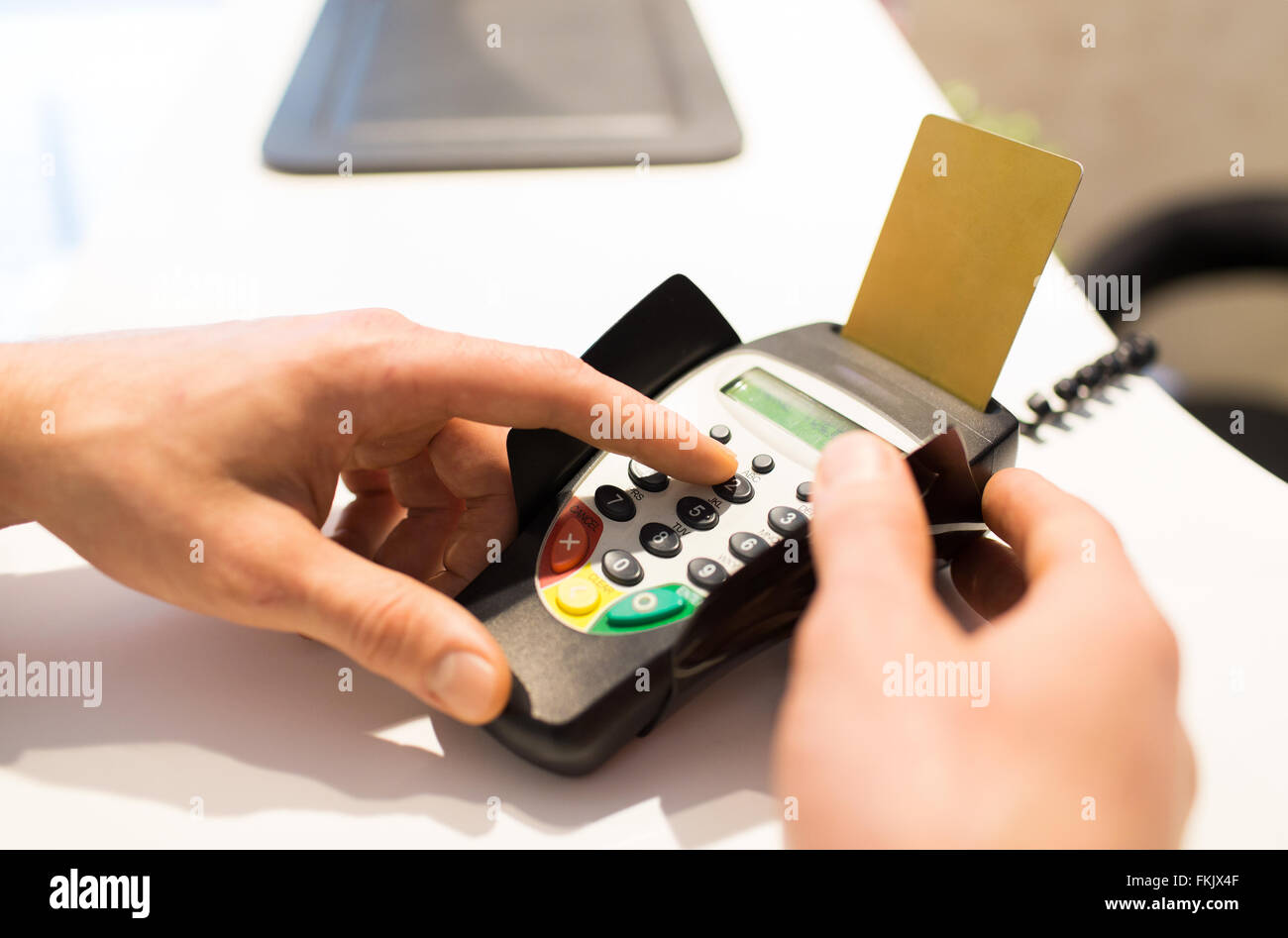 hand entering pin code to bank terminal Stock Photo - Alamy