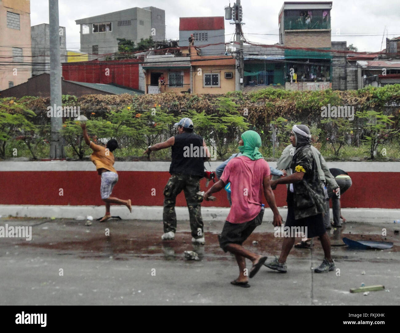 Residents of Brgy. Culiat throw rocks and other projectiles at ...