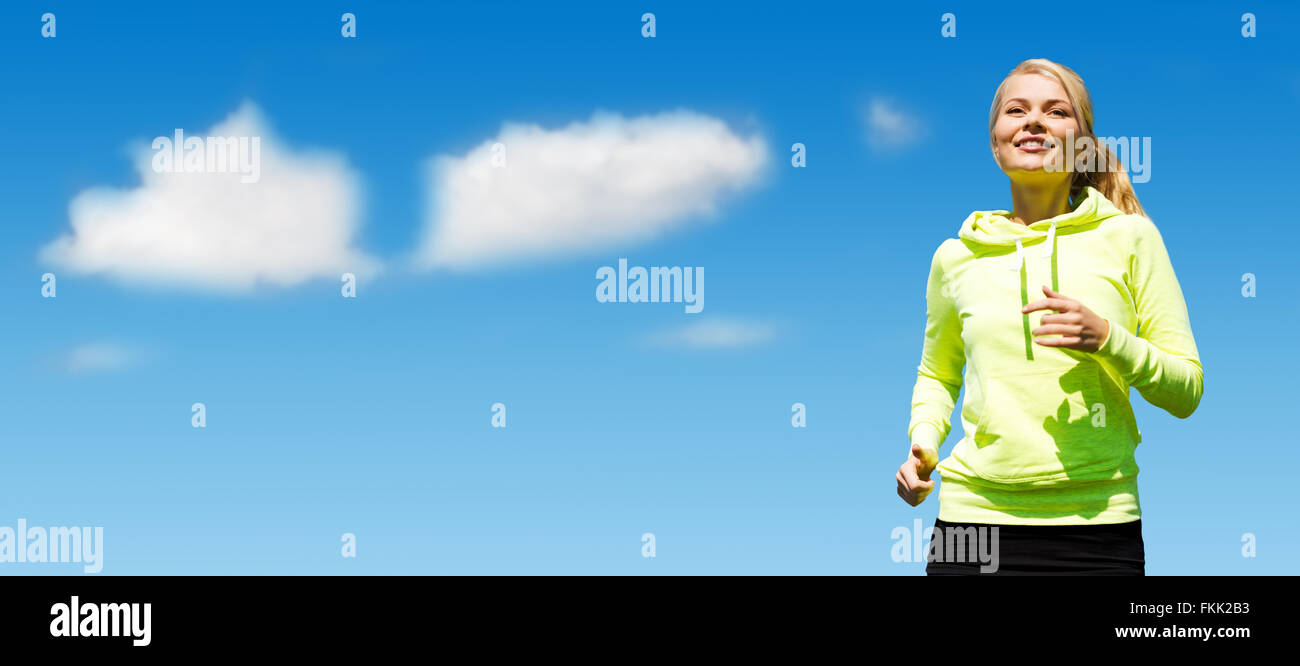woman jogging over blue sky and clouds background Stock Photo - Alamy