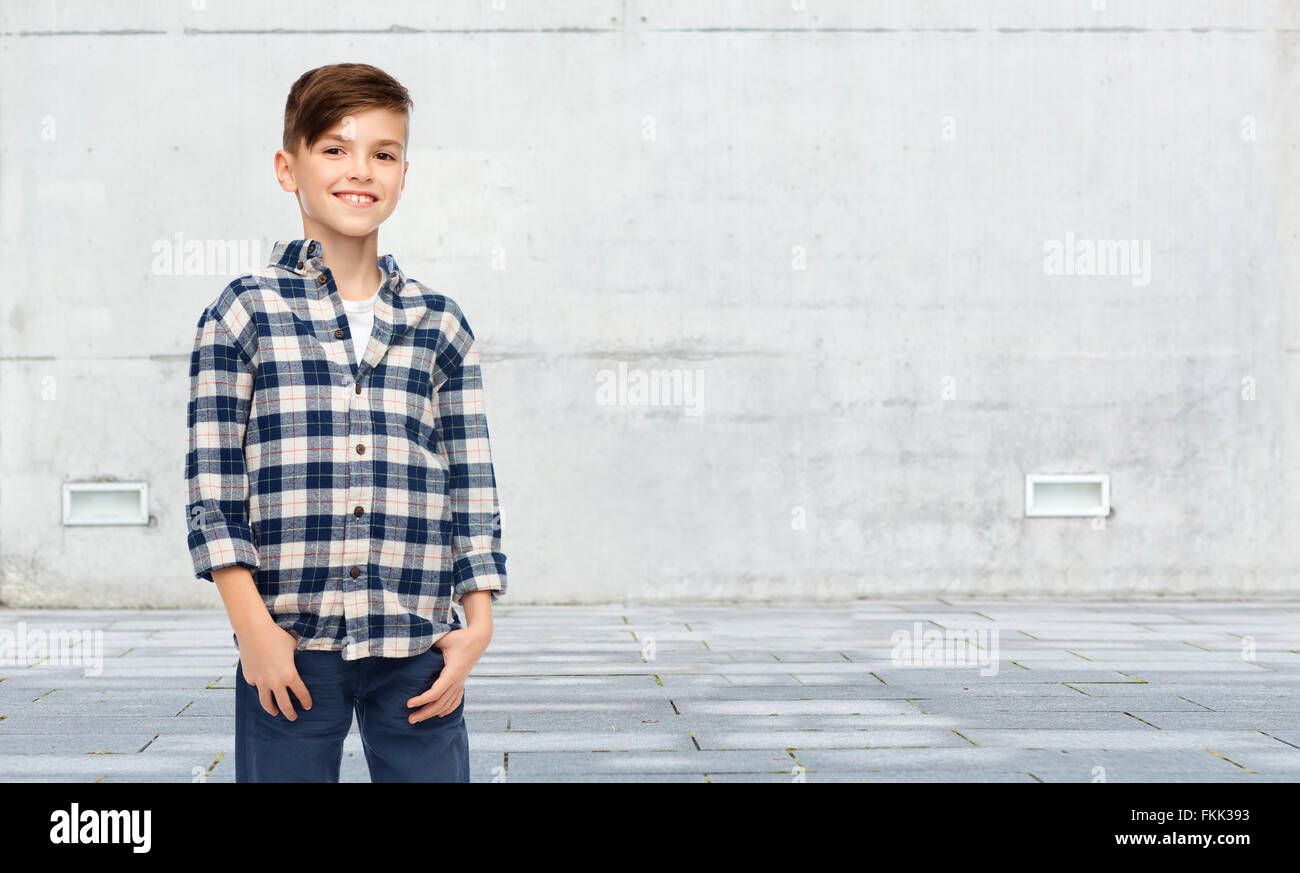 smiling boy in checkered shirt and jeans Stock Photo - Alamy