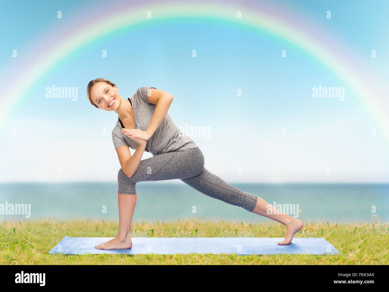 woman making yoga low angle lunge pose on mat Stock Photo - Alamy