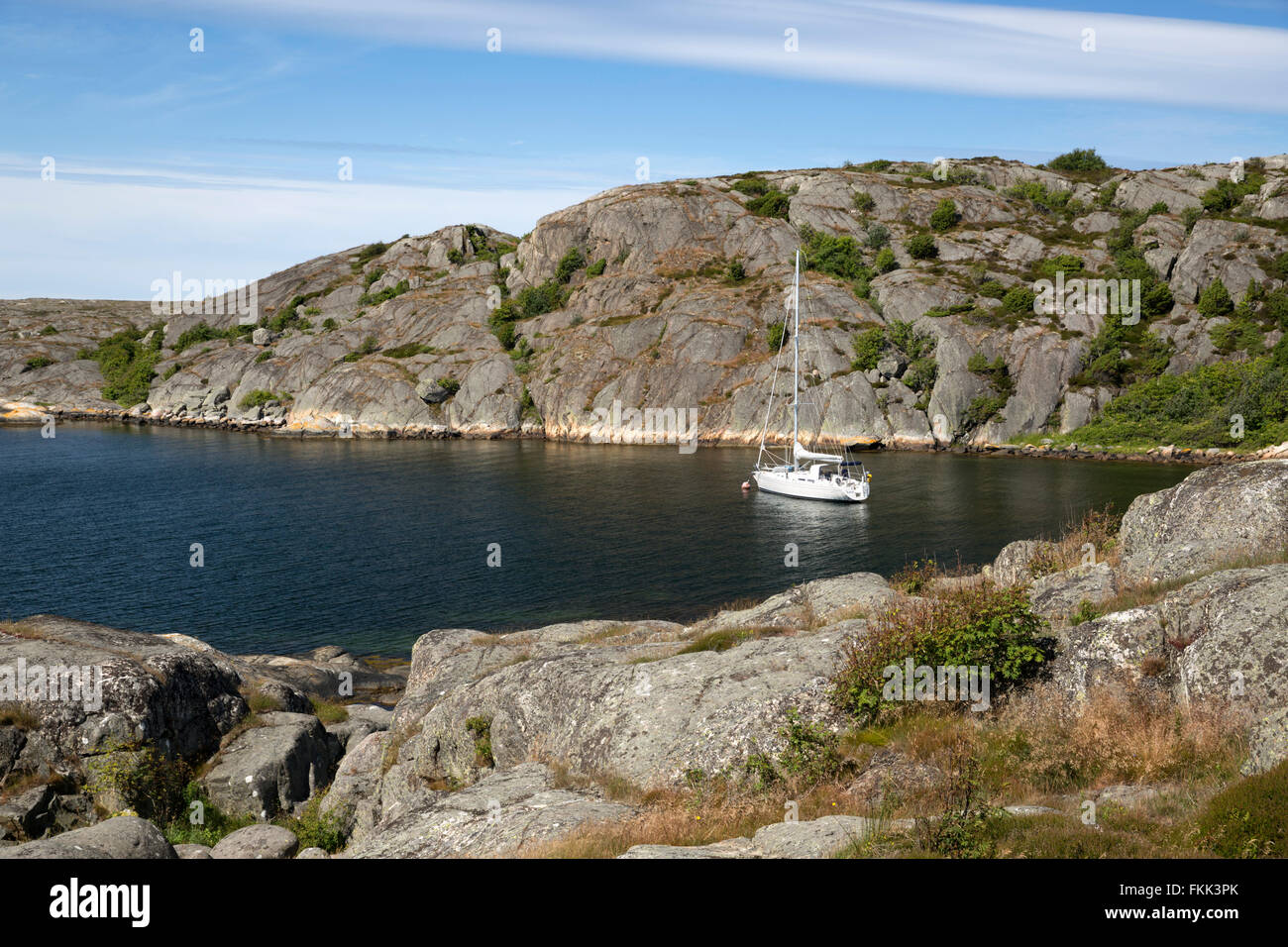 Yacht in rocky inlet hi-res stock photography and images - Alamy